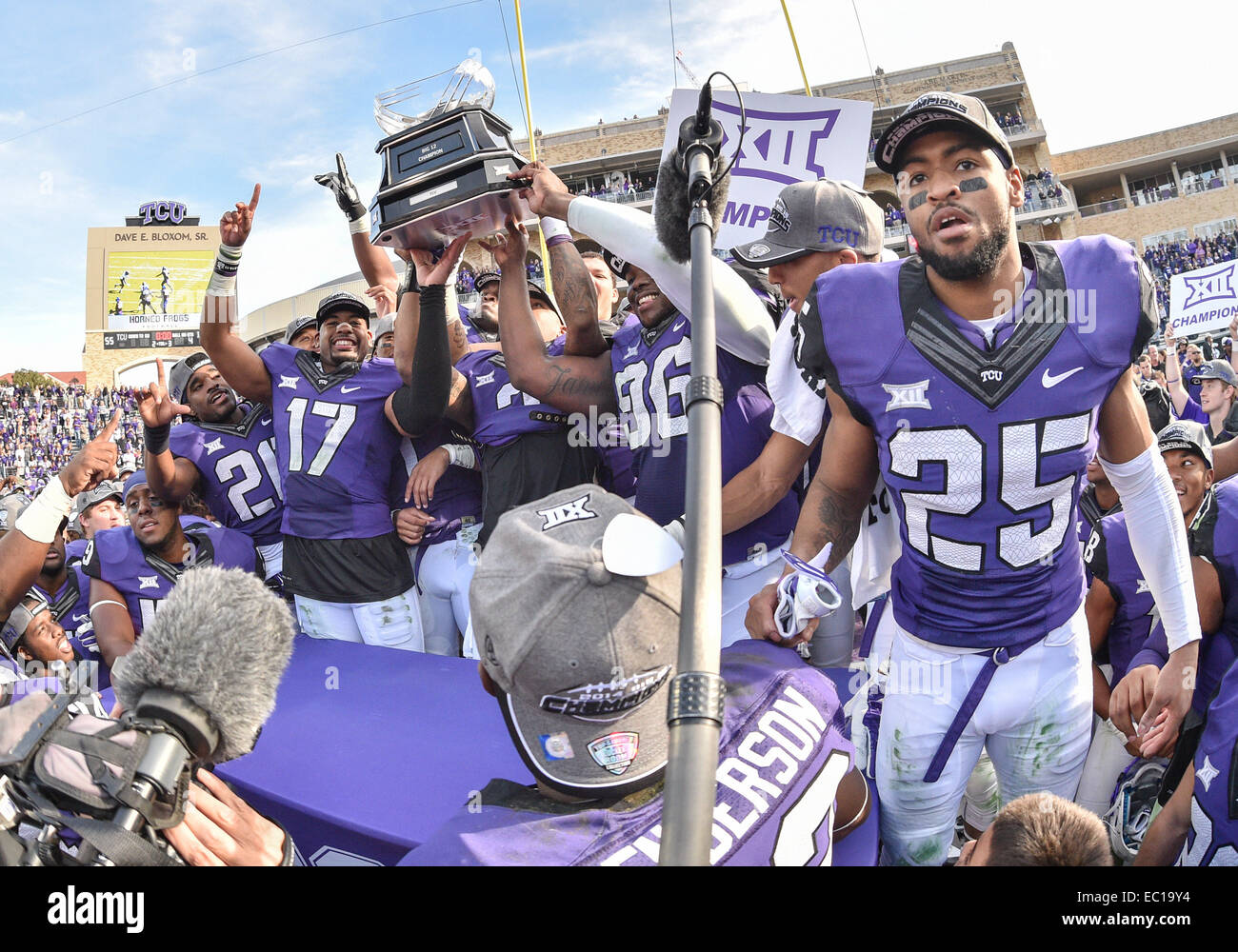 TCU players celebrate and pose with the Big-12 trophy after an NCAA ...