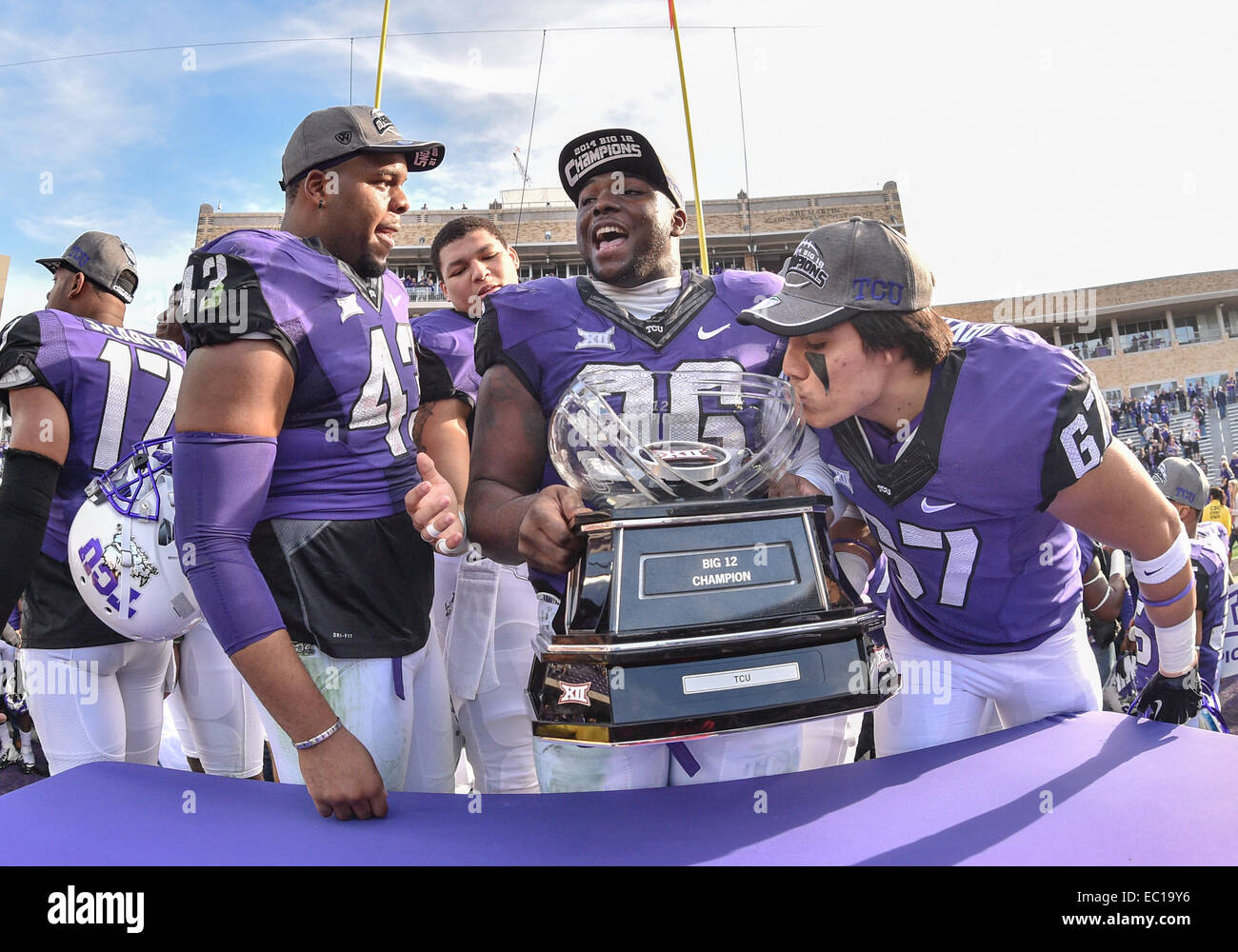 TCU players celebrate and pose with the Big-12 trophy after an NCAA ...