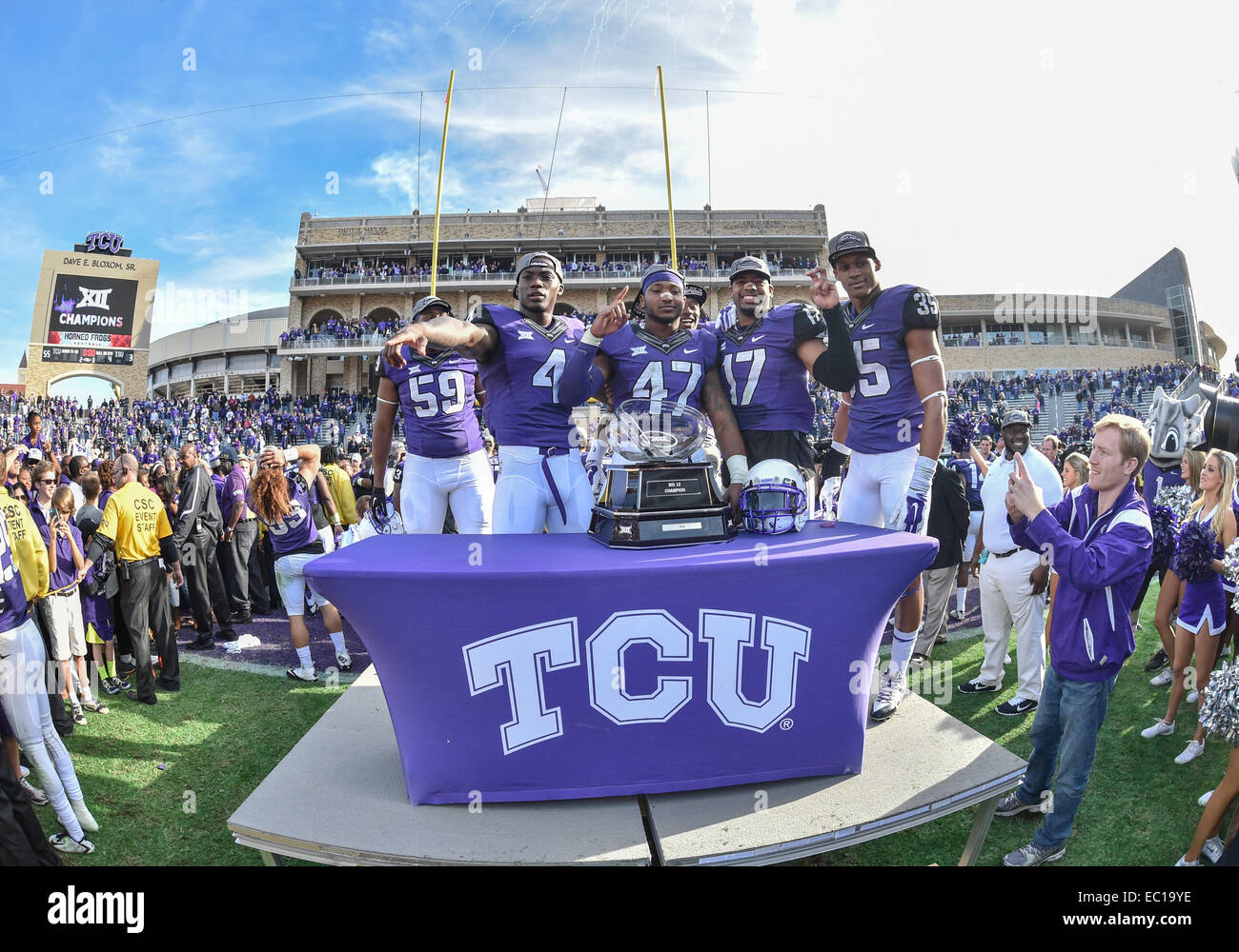 TCU players celebrate and pose with the Big-12 trophy after an NCAA ...