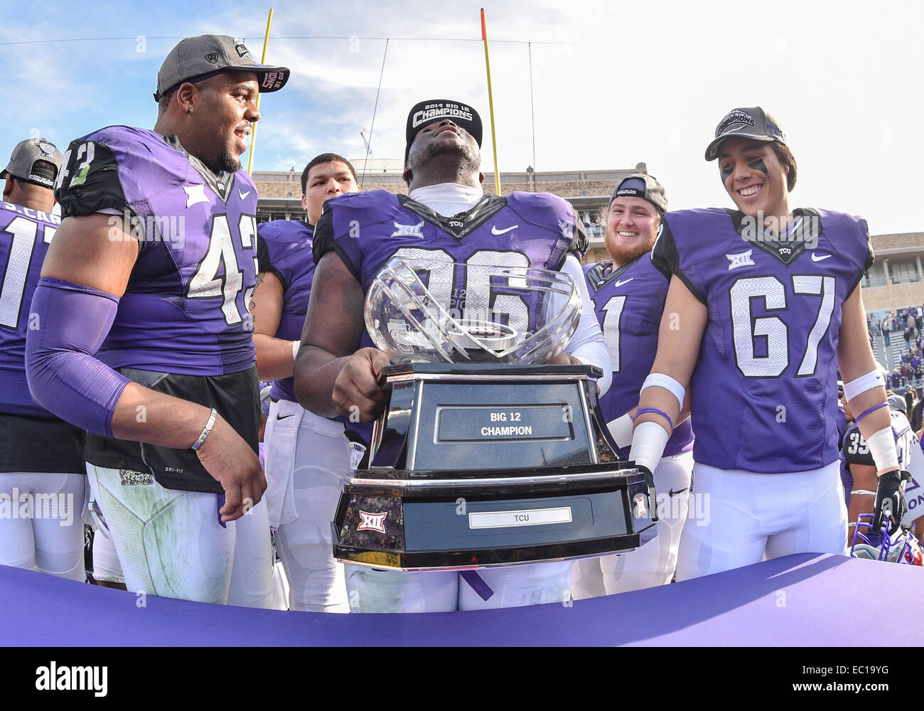 TCU players celebrate and pose with the Big-12 trophy after an NCAA ...