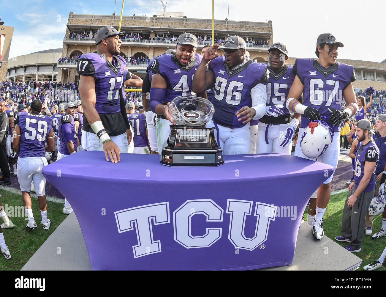 TCU players celebrate and pose with the Big-12 trophy after an NCAA ...