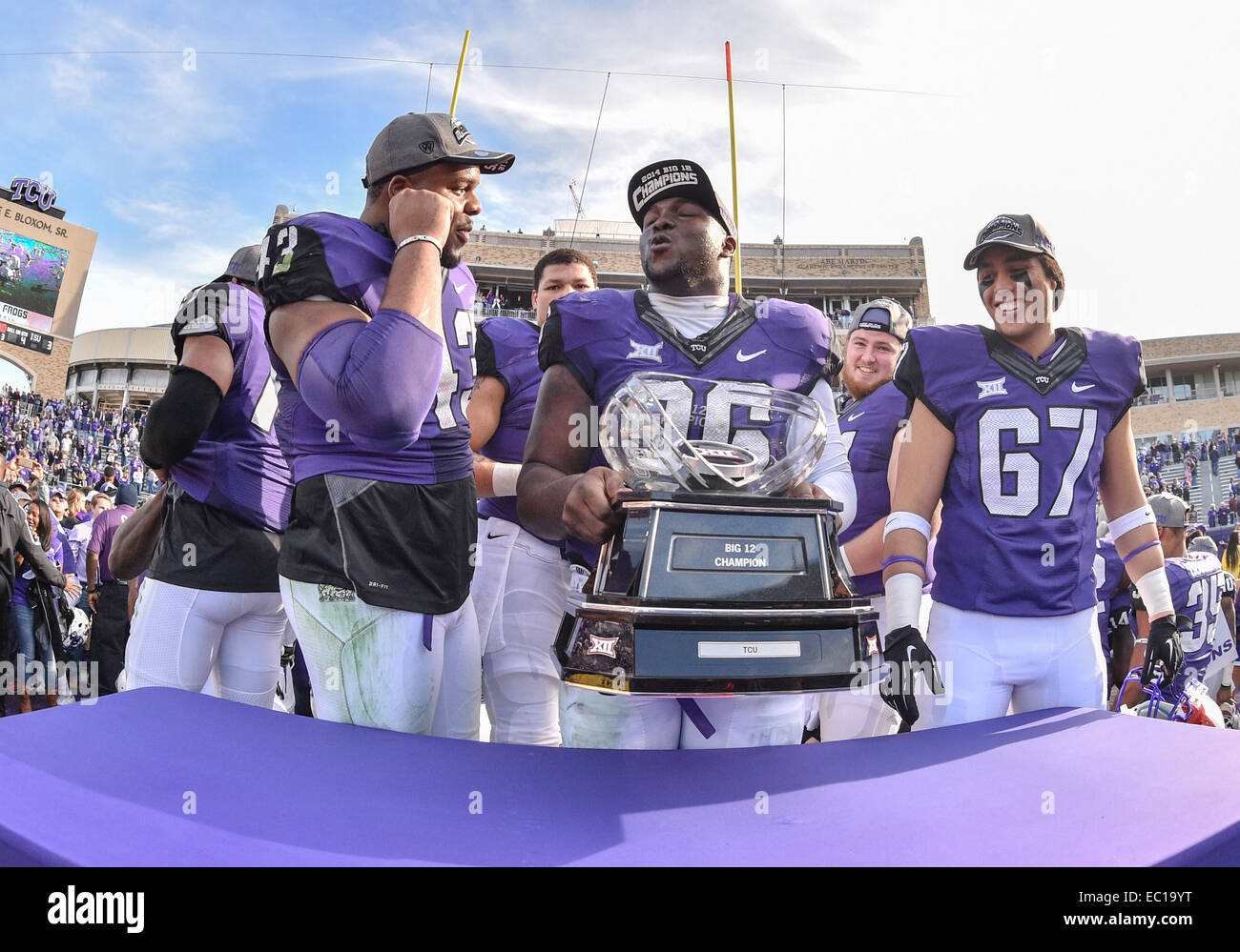 TCU players celebrate and pose with the Big-12 trophy after an NCAA ...