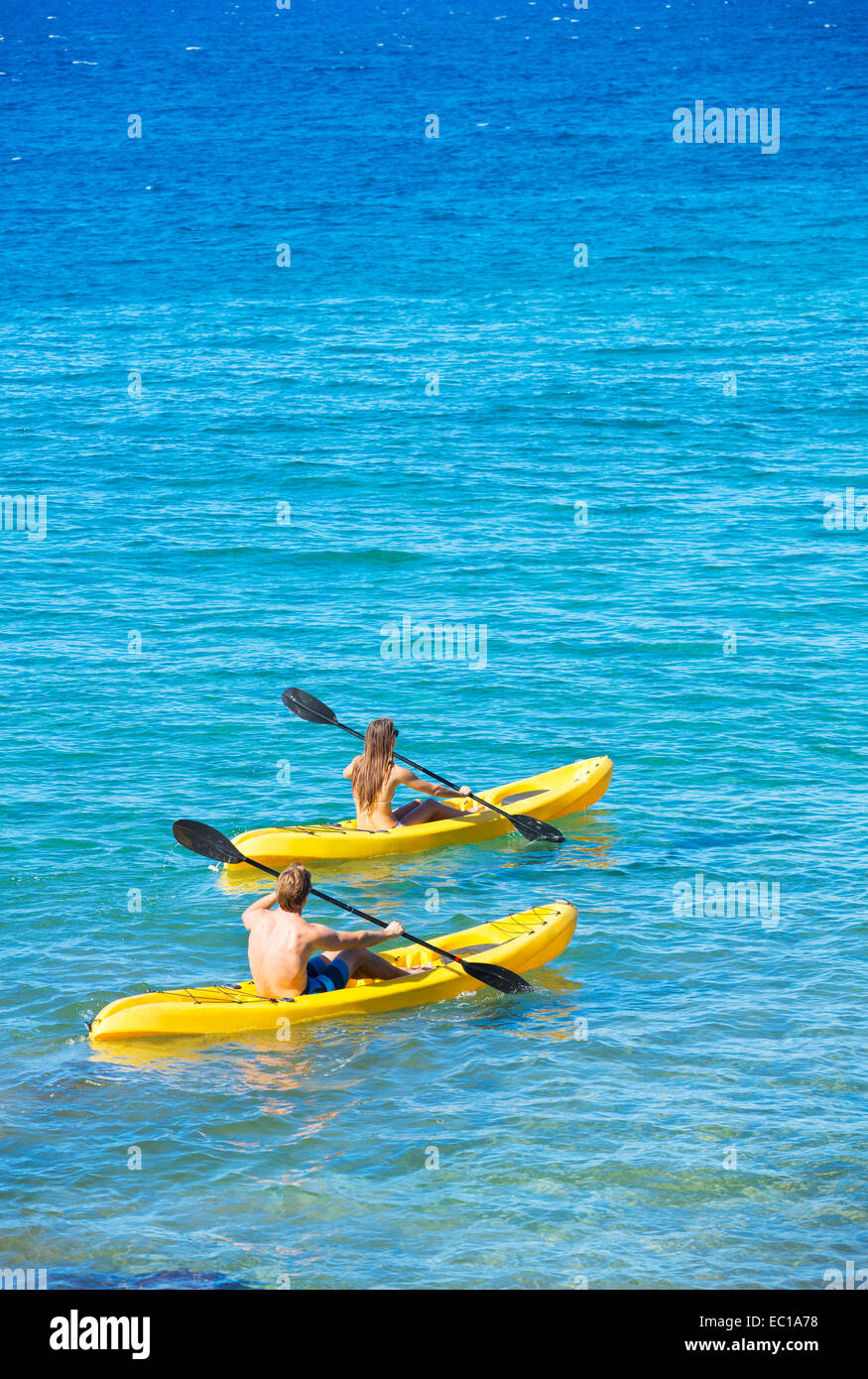 Couple Kayaking in the Ocean on Vacation Stock Photo - Alamy