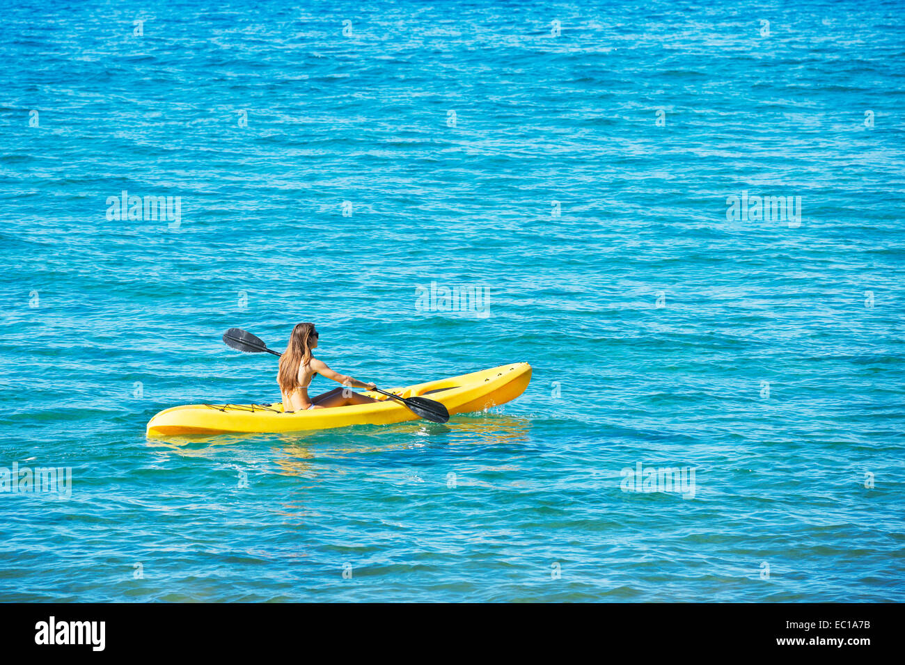 Woman Kayaking in the Ocean Stock Photo - Alamy