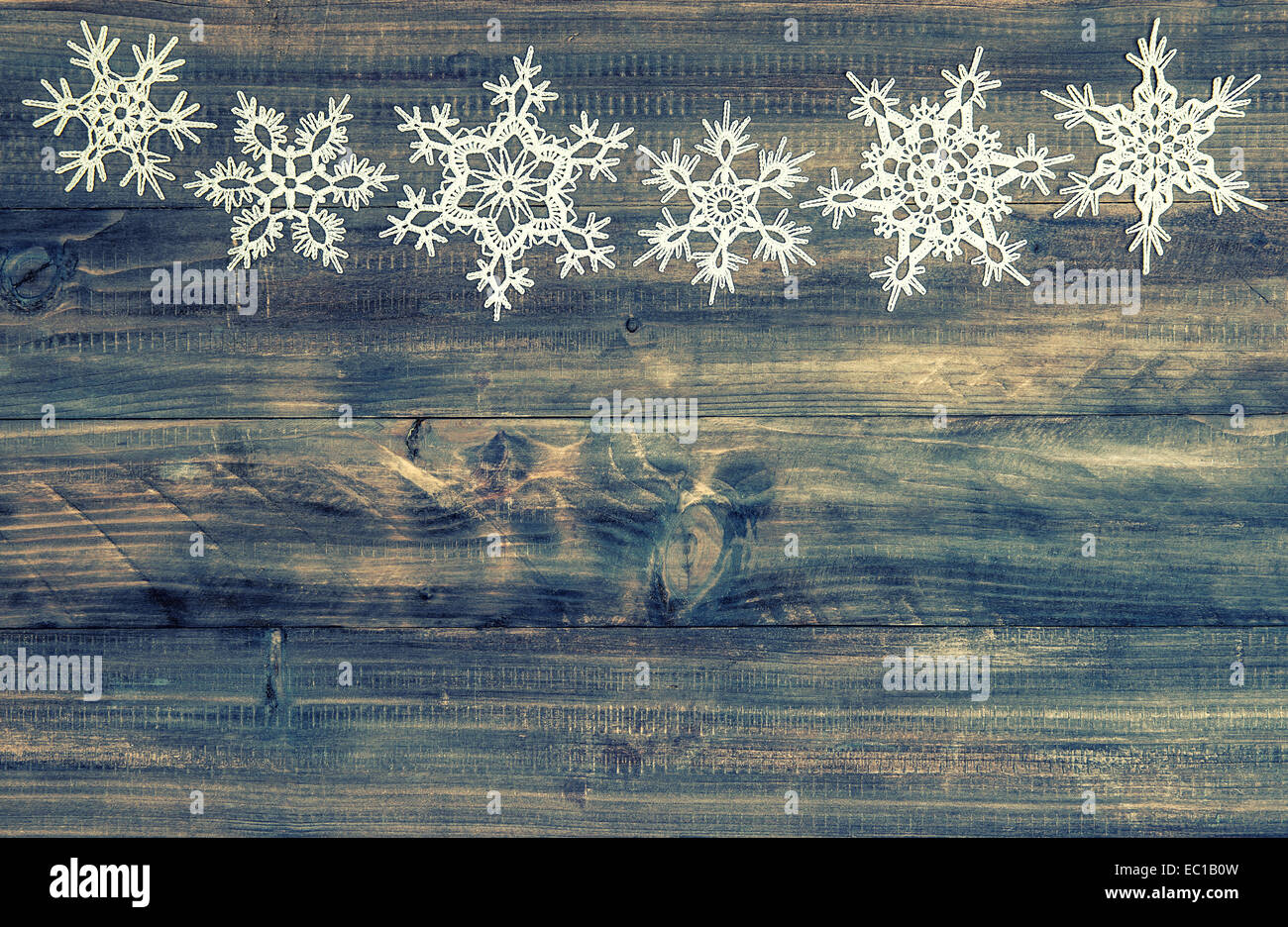 snowflakes border on rustic wooden background. christmas decoration ...