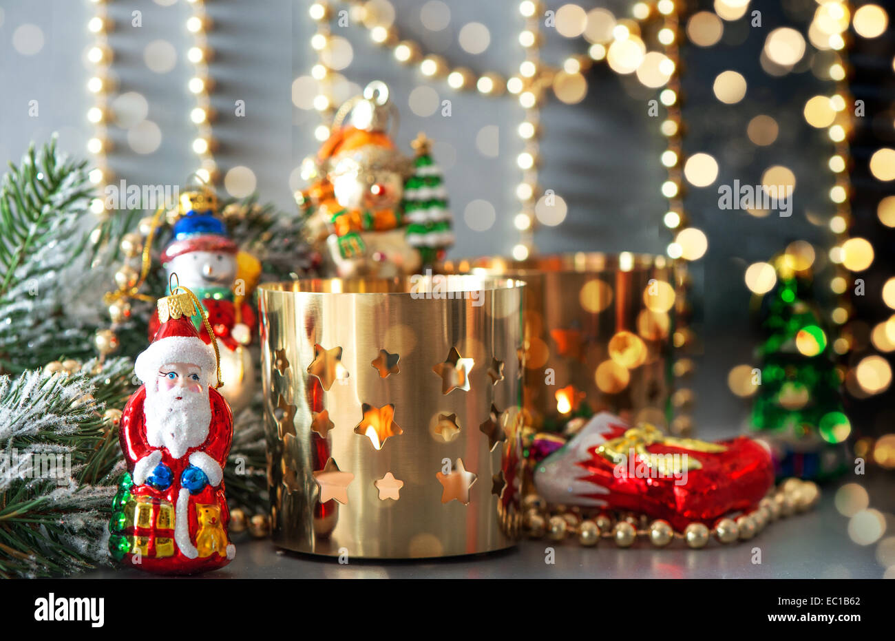 christmas decorations with golden lanterns and defocused lights ...