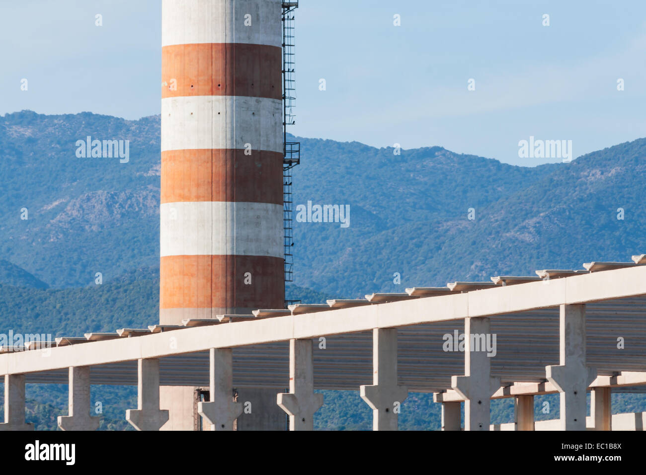 red and white chimney with industrial building Stock Photo - Alamy