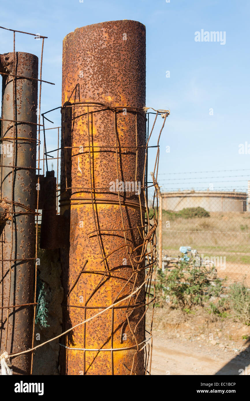 Rusted wire netting in industrial place. Particular of a pylon Stock ...
