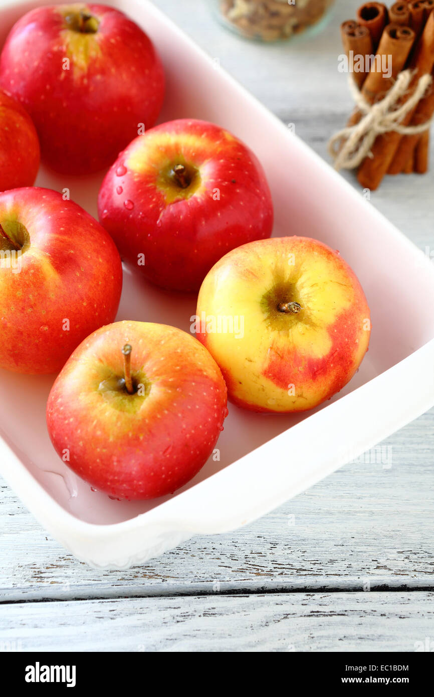 Red apples in a white bowl, cooking food Stock Photo - Alamy