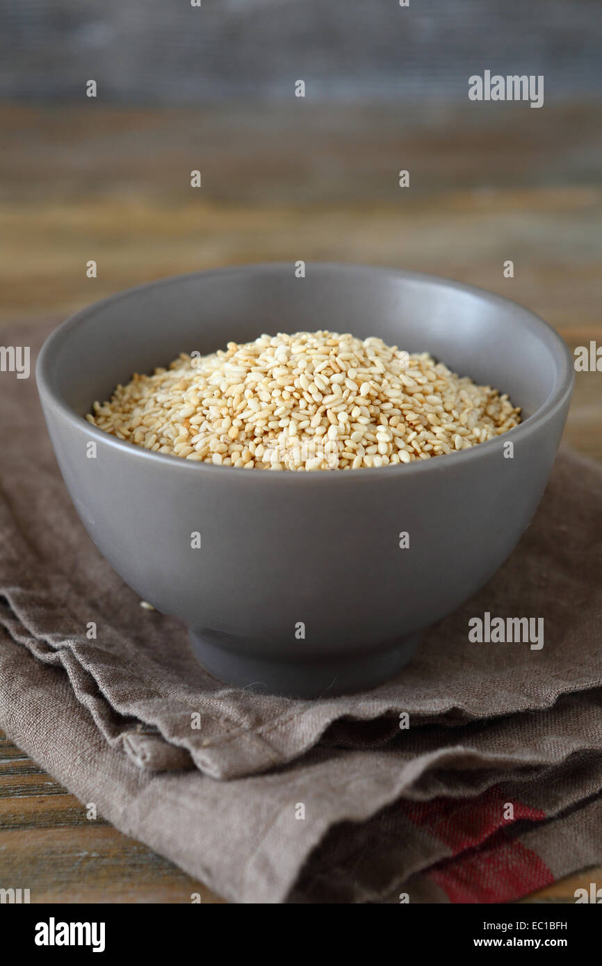 Sesame fried in a bowl on the boards, closeup Stock Photo - Alamy
