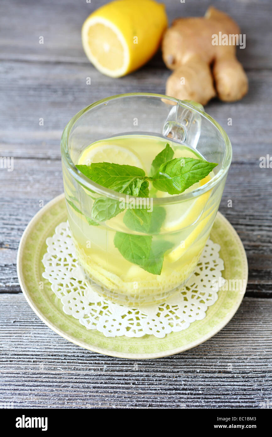 Ginger tea with mint leaves and lemon Stock Photo - Alamy