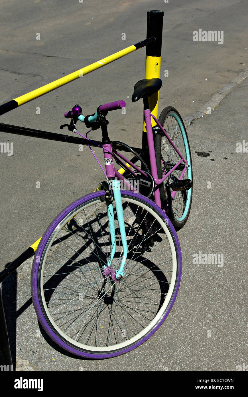 Funny colored bike parked at street at sunny summer day Stock Photo - Alamy