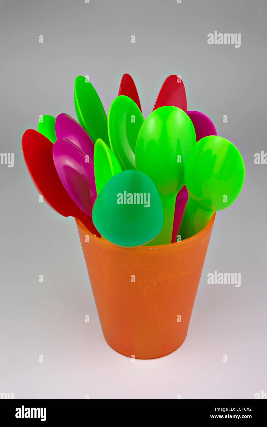 Colorful plastic spoons, stacked and ready for use Stock Photo - Alamy