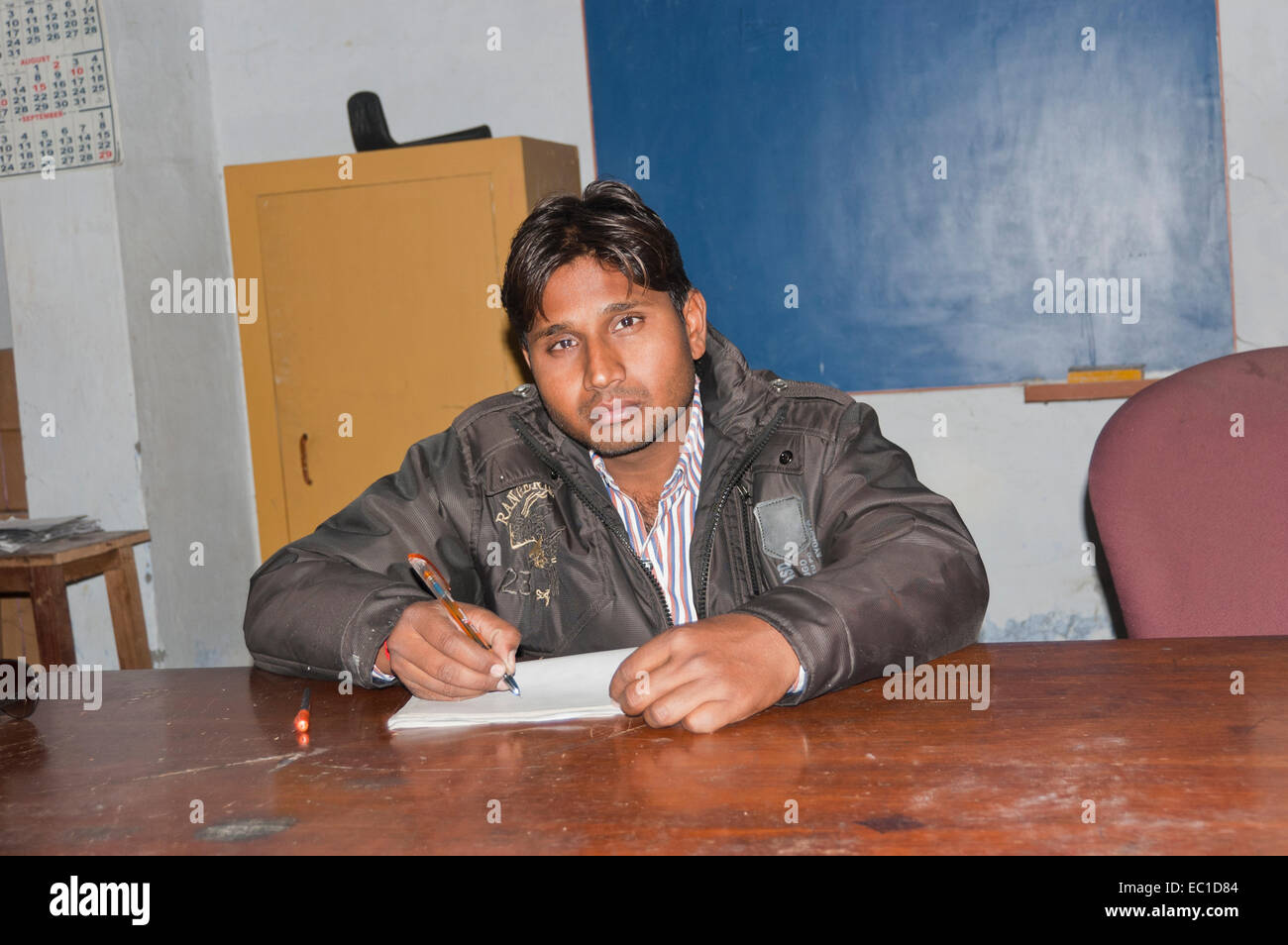 1 Indian Man writing Notes Stock Photo - Alamy