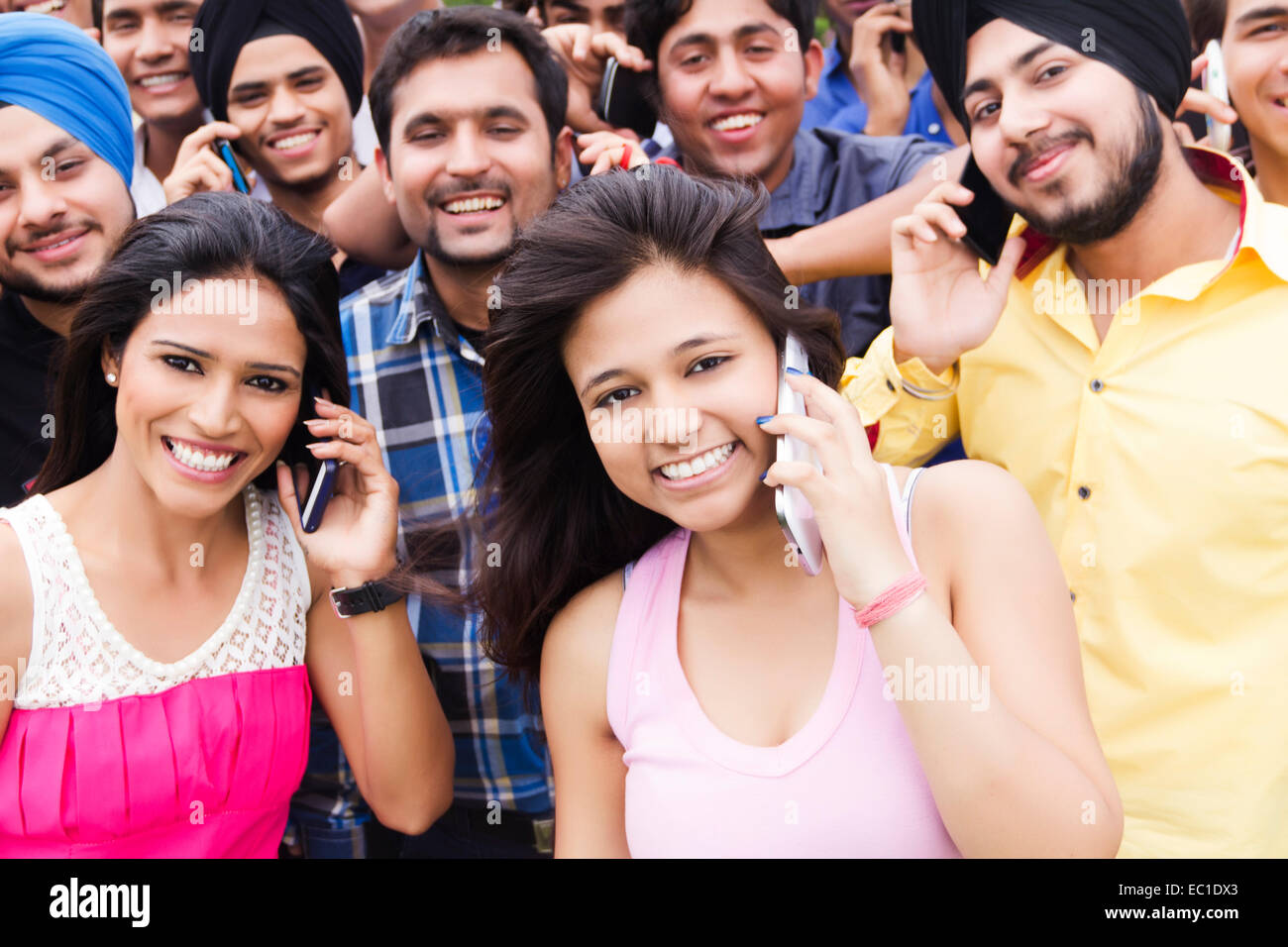 indian group crowds park talking phone Stock Photo - Alamy