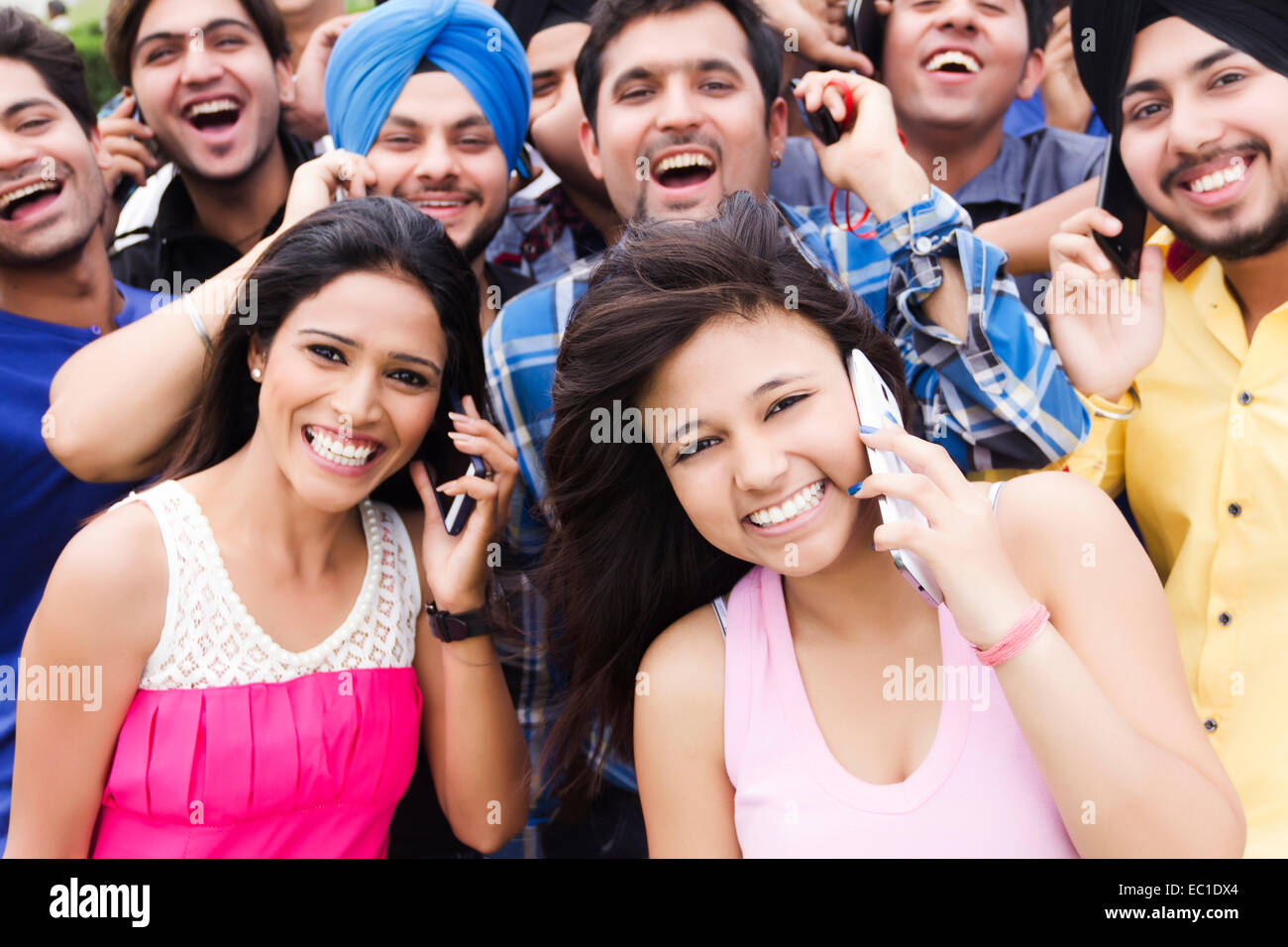 indian group crowds park talking phone Stock Photo - Alamy
