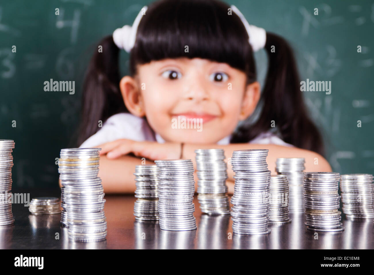 Girl school desk classroom money hi-res stock photography and images ...