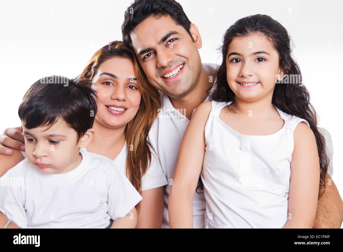 indian Parents with child sitting home Stock Photo - Alamy