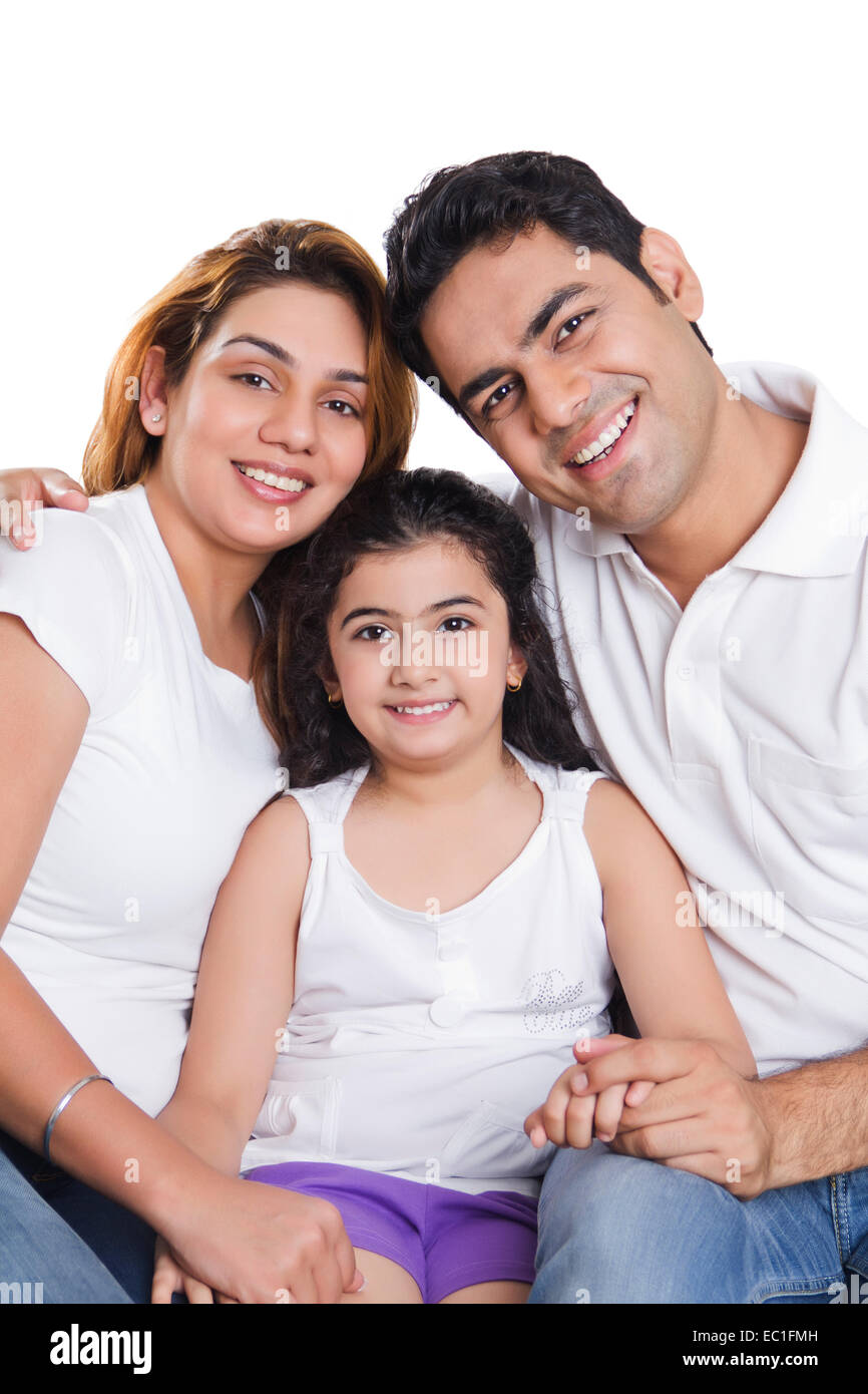indian Parents with child sitting home Stock Photo - Alamy