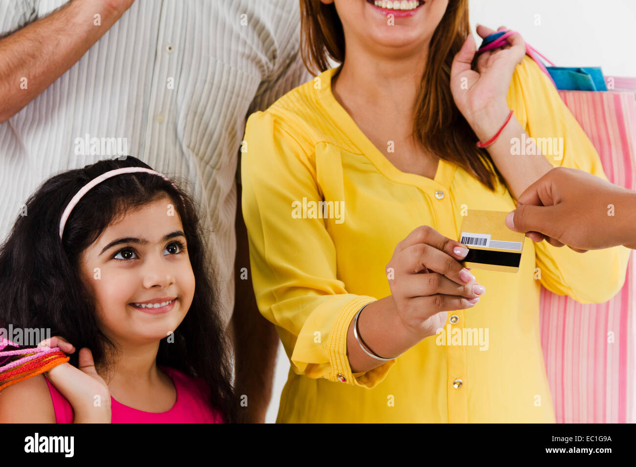 indian Parents with child Shopping credit card payment Stock Photo - Alamy