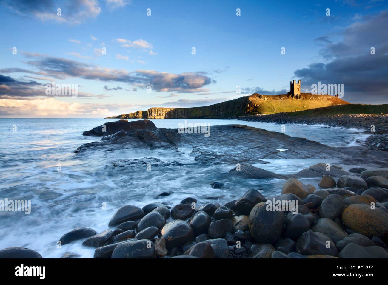 Dunstanburgh Castle at Sunset Northumberland Coast England Stock Photo ...