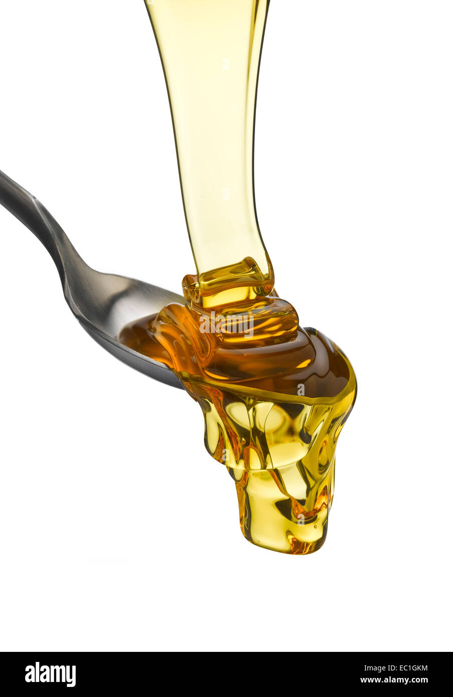 Flowing golden syrup Stock Photo - Alamy