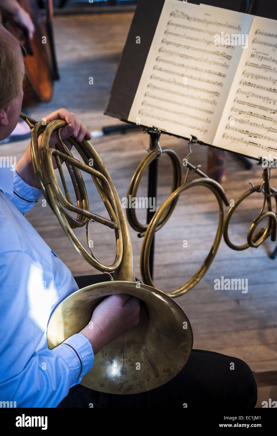 Classical natural horn, with crooks hanging from music stand. The ...