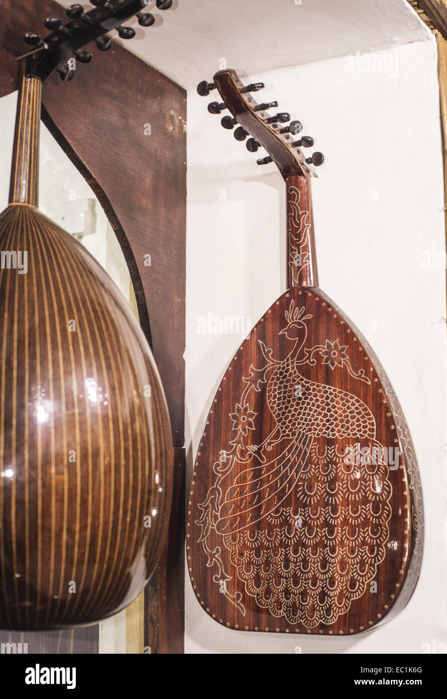 Ornate Ouds. In Qatari maker's workshop. Showing carved peacock design ...