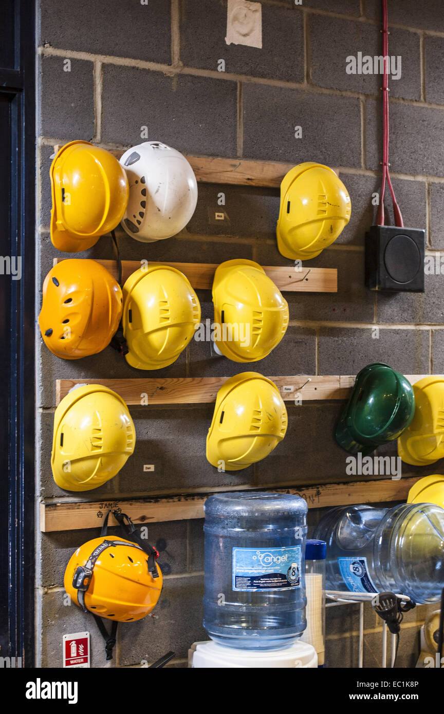 Hard hats backstage on theatre wall, with fresh water fountain, for the ...