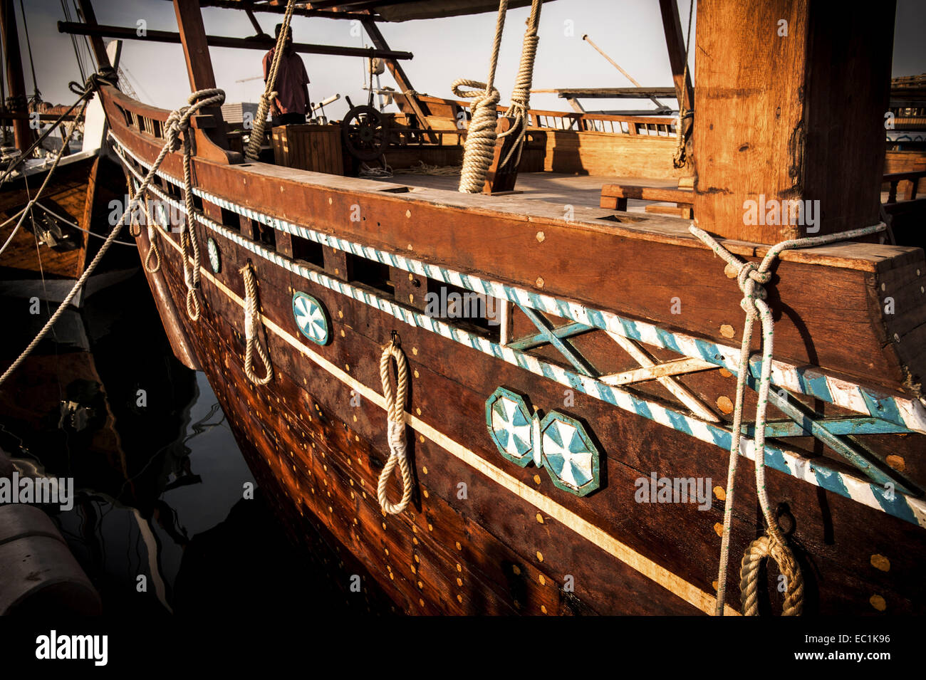 Ornate Arab dhow with wooden rivets; in Fishing Harbour moored at dawn ...