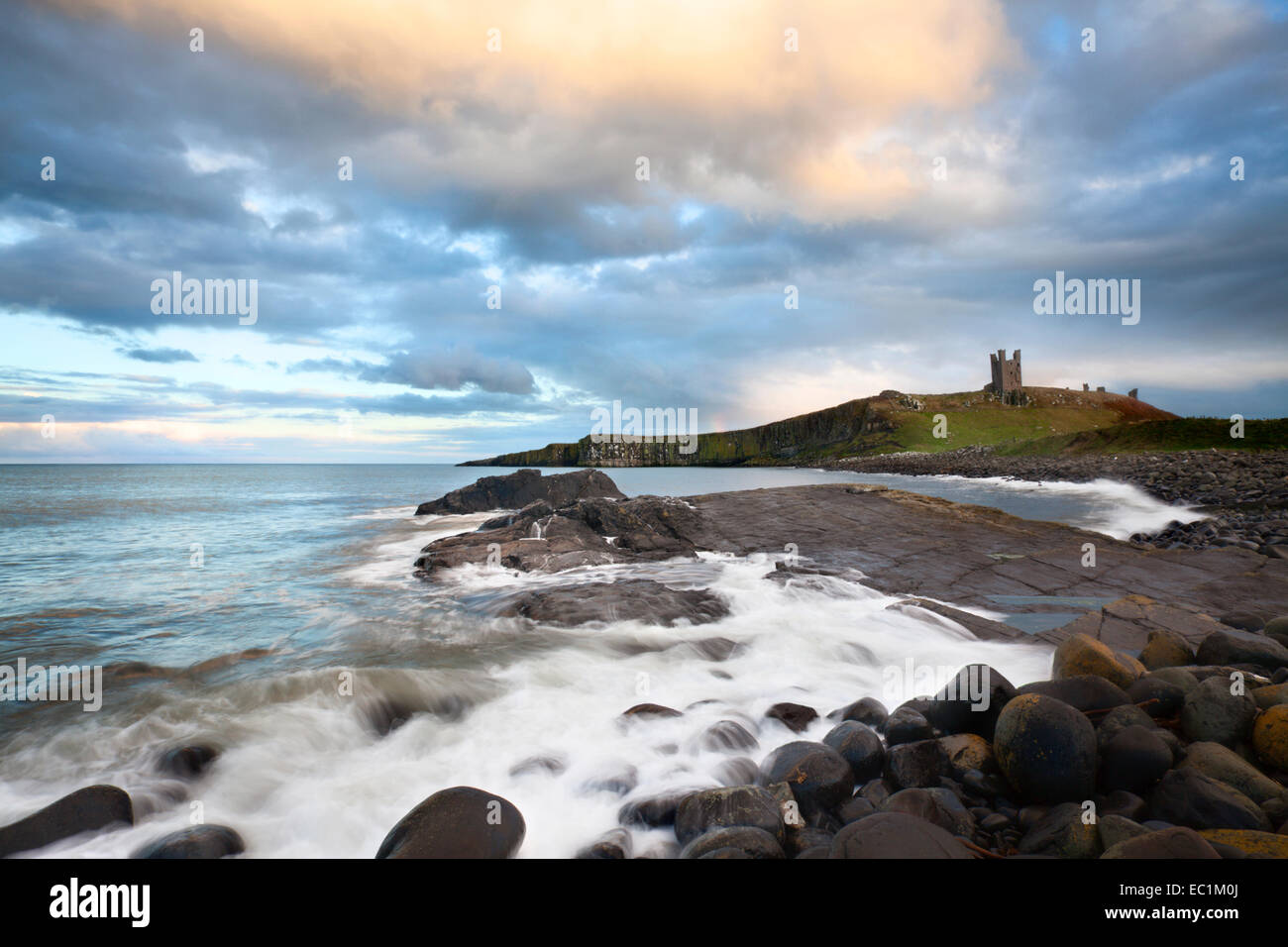 Greymare Rock and Dunstanburgh Castle at Dusk Northumberland Coast ...