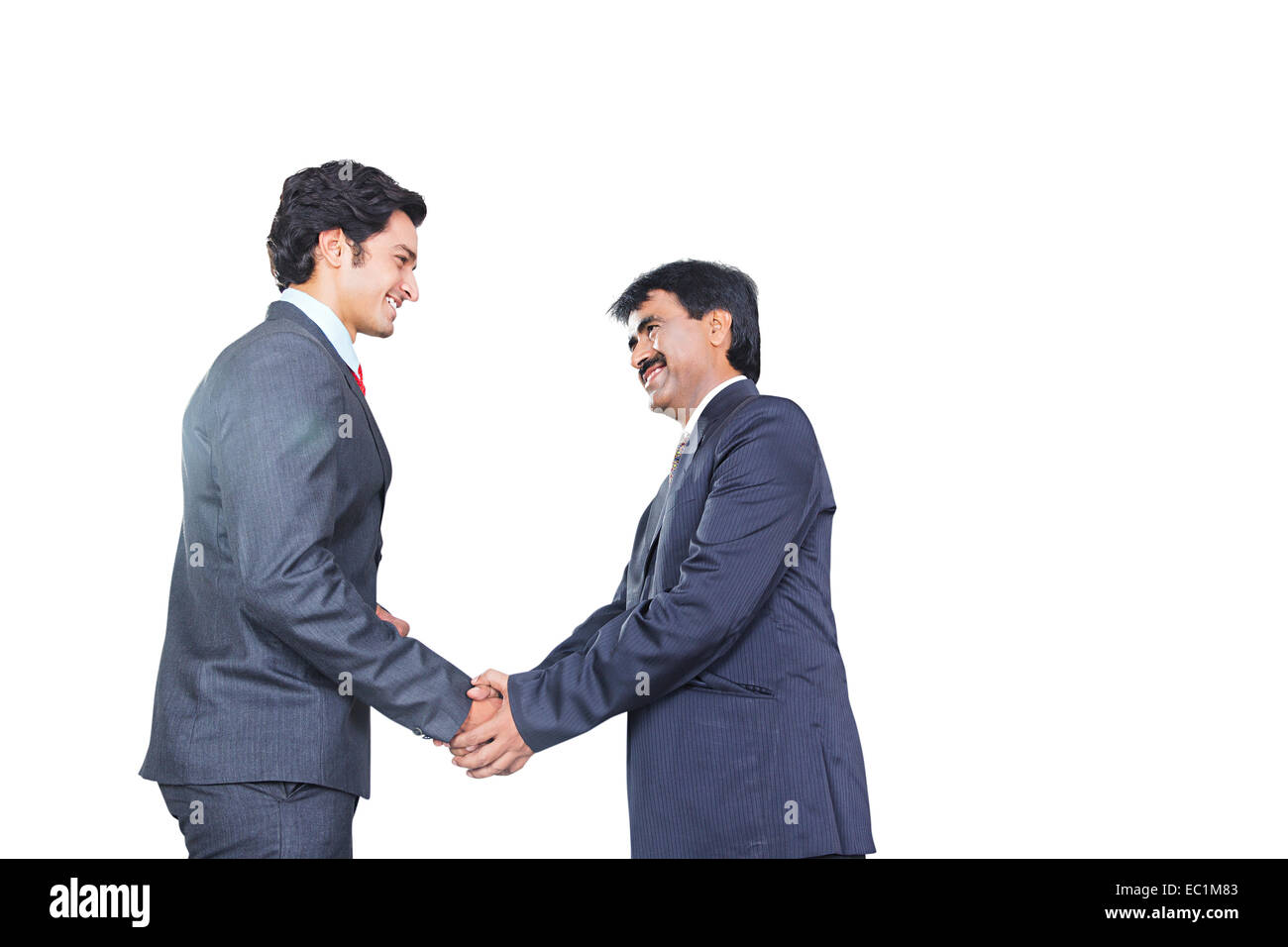 Two friends shaking hands smiling hi-res stock photography and images - Alamy