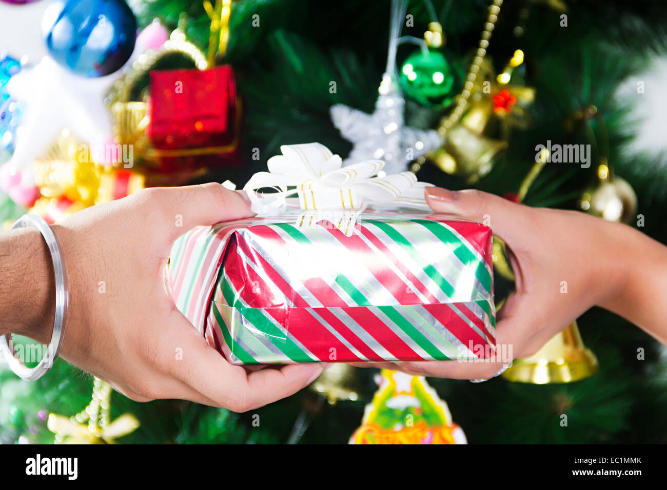 Giving present to friend hi-res stock photography and images - Alamy