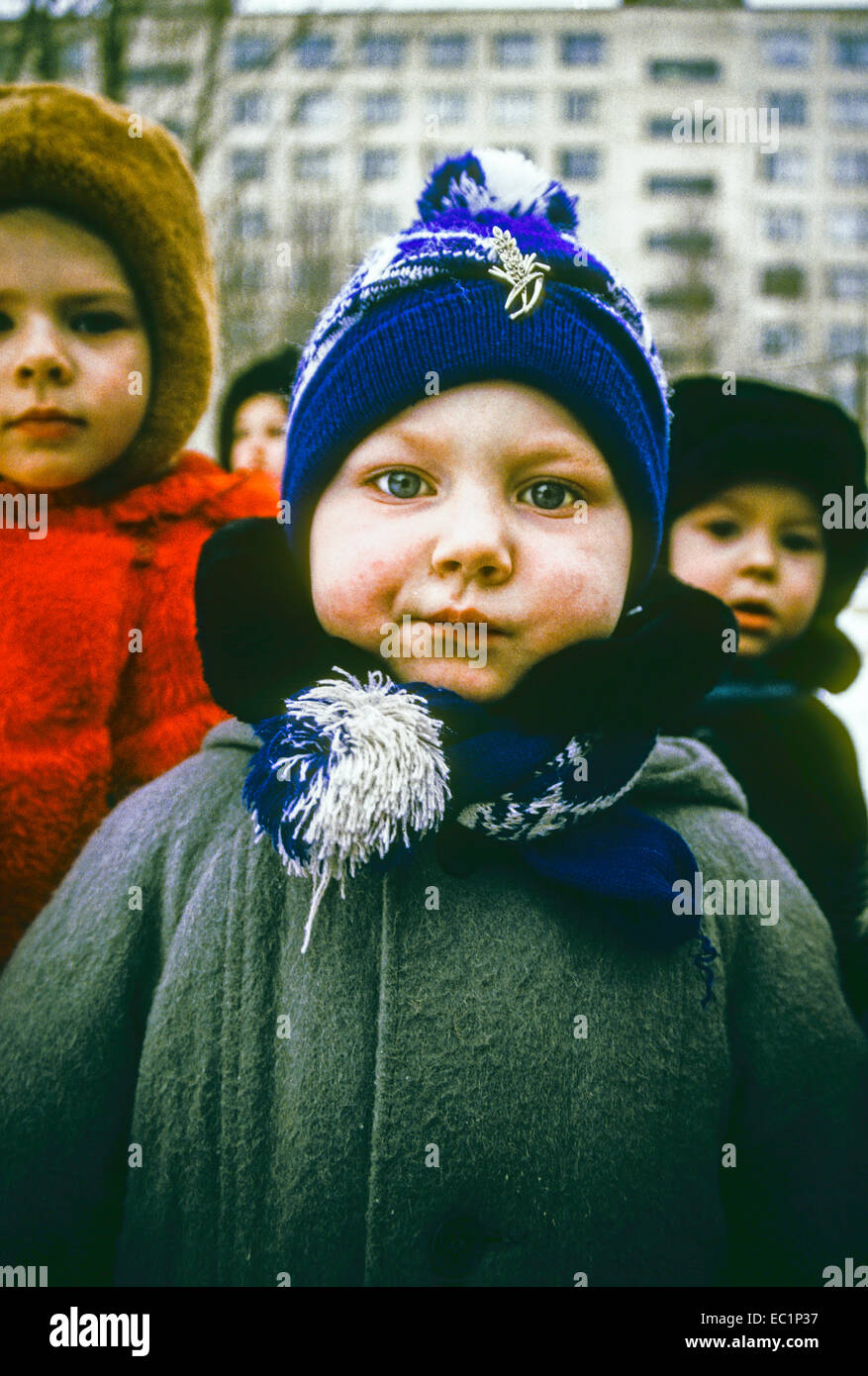 Young children in winter clothes for recess in the snow at Kindergarten ...
