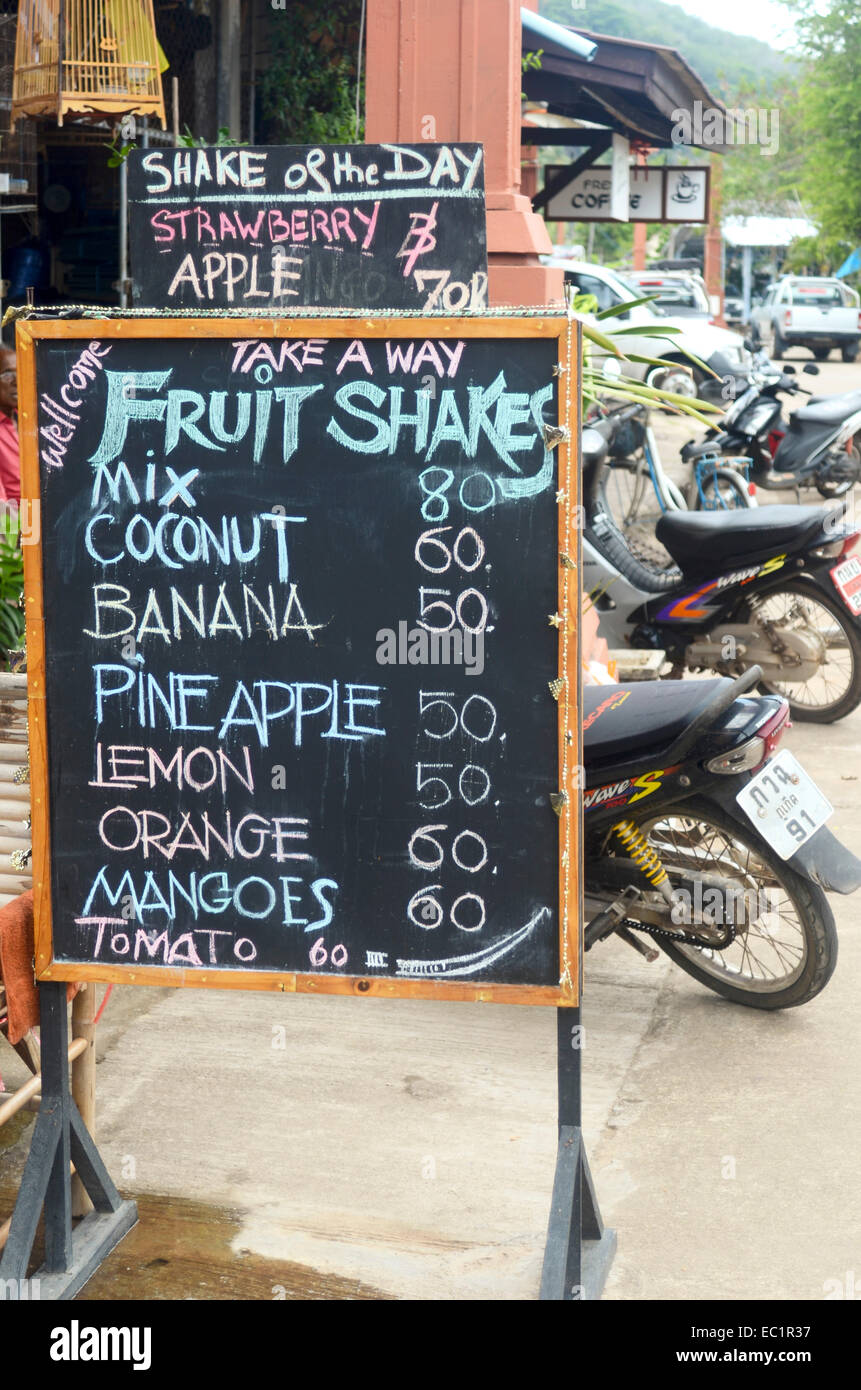 Board and price-list advertising fresh fruit shake drinks outside cafe ...