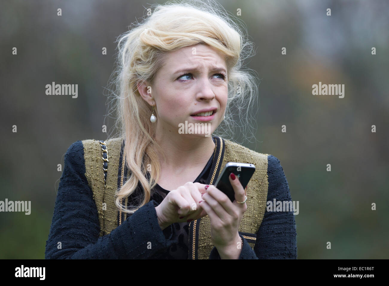 Women experiencing bad mobile phone connection outdoors Stock Photo - Alamy