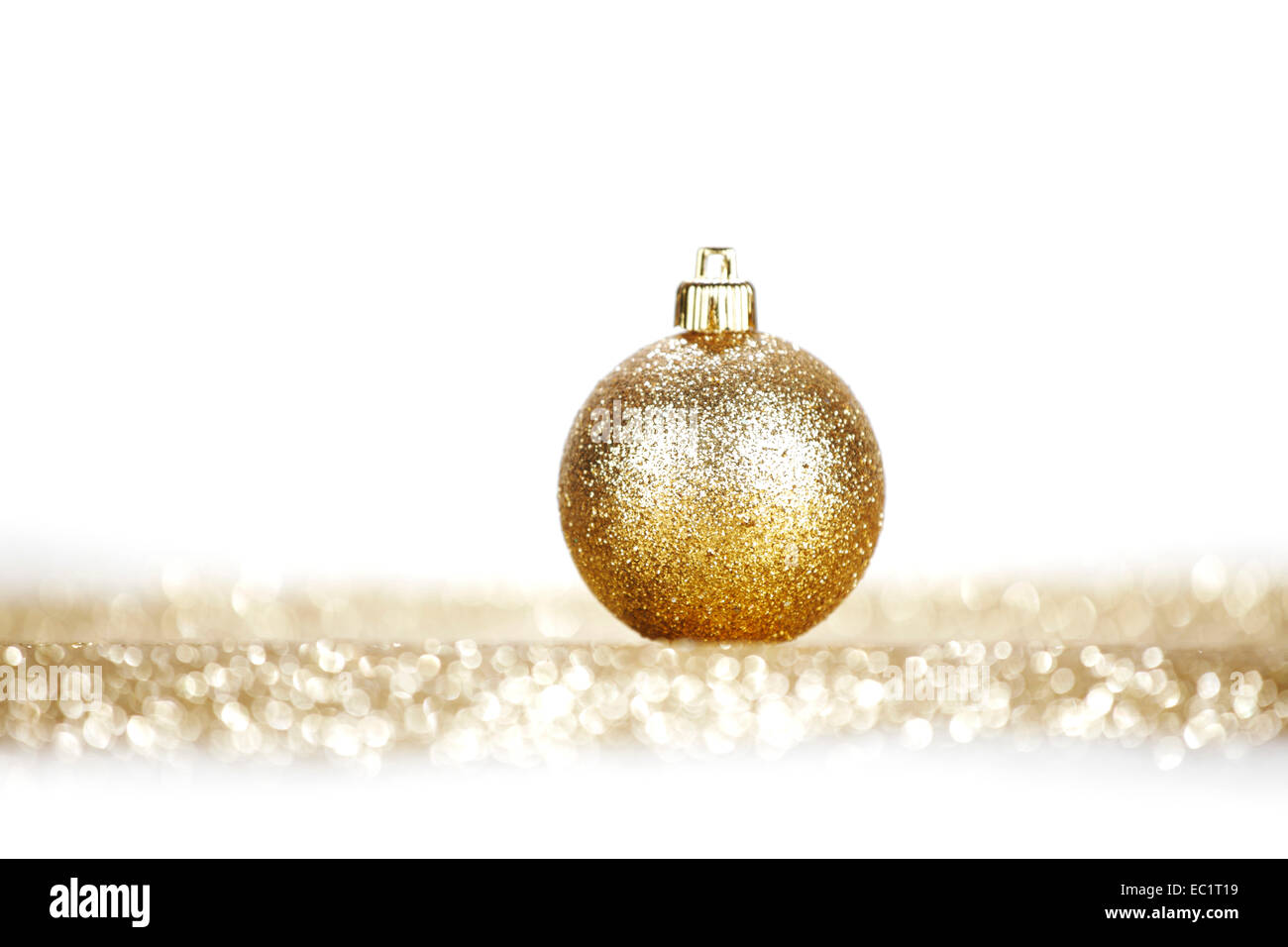One chritmas ball on glitters isolated on white background Stock Photo ...