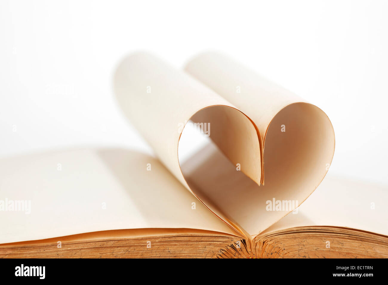 Heart made of blank pages inside a book on white background Stock Photo ...