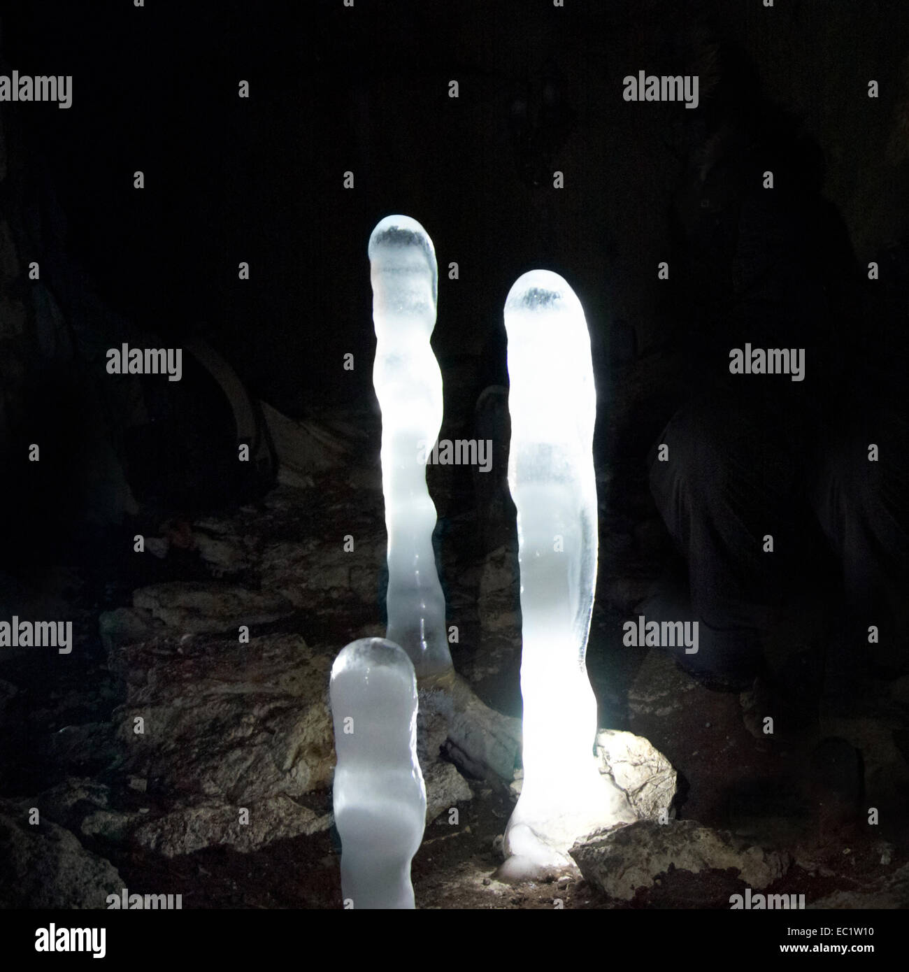 Luminescent ice stalagmites in the cave Stock Photo - Alamy