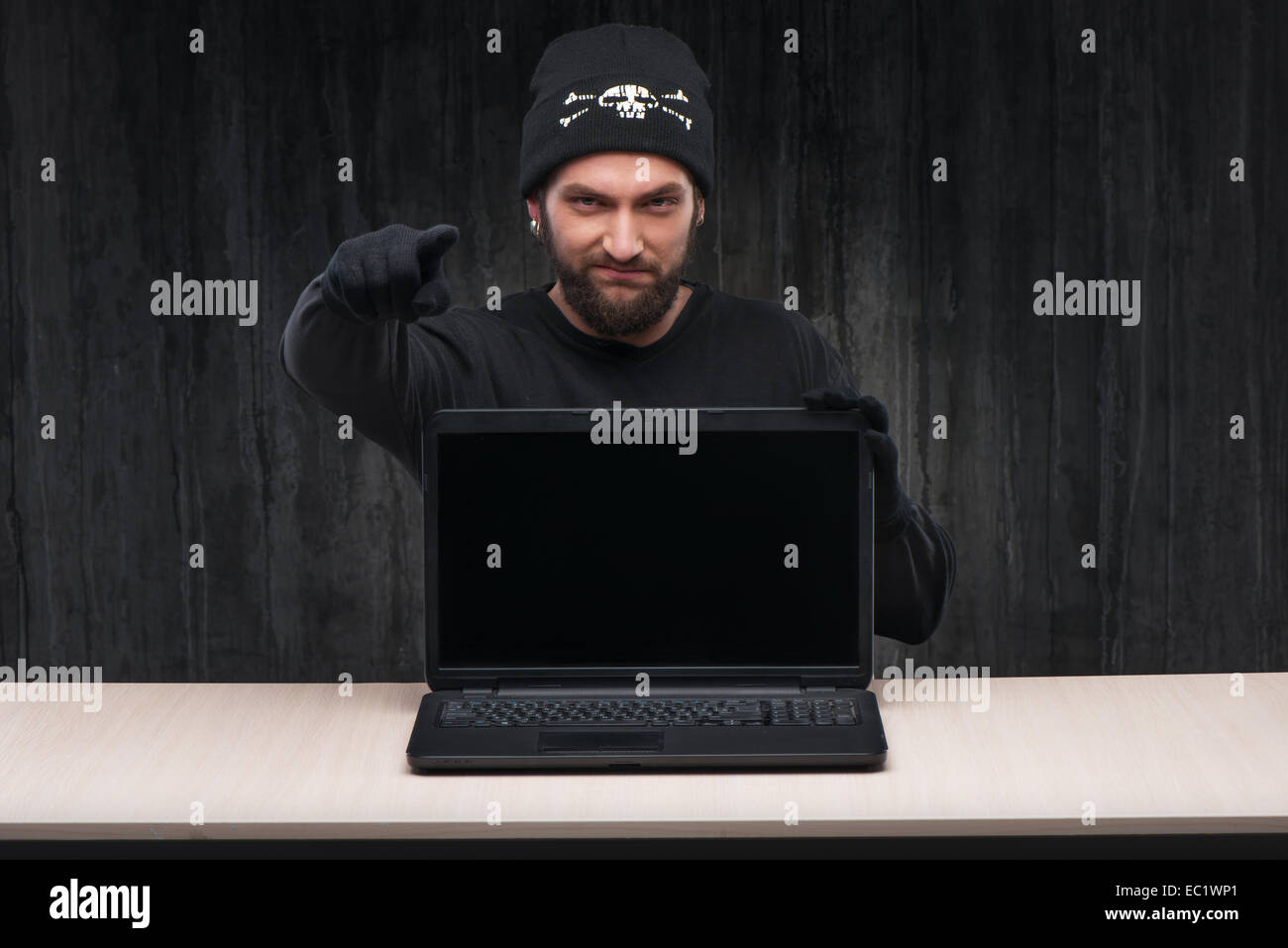 Bearded computer hacker with a laptop. Computer hacker concept Stock ...