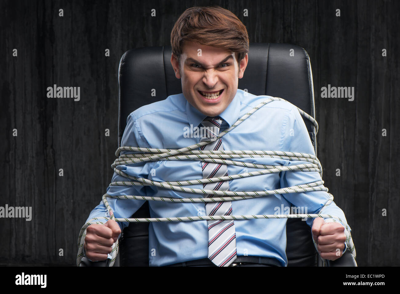 White collar angry knotted criminal under arrest Stock Photo - Alamy
