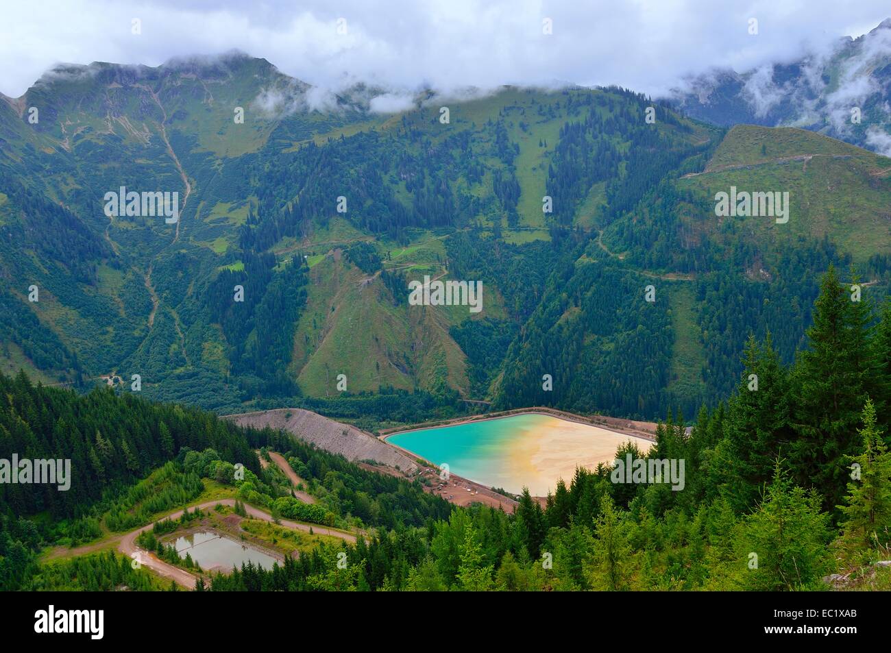 Sedimentation pool, sludge pond in the mining area of the open pit mine ...