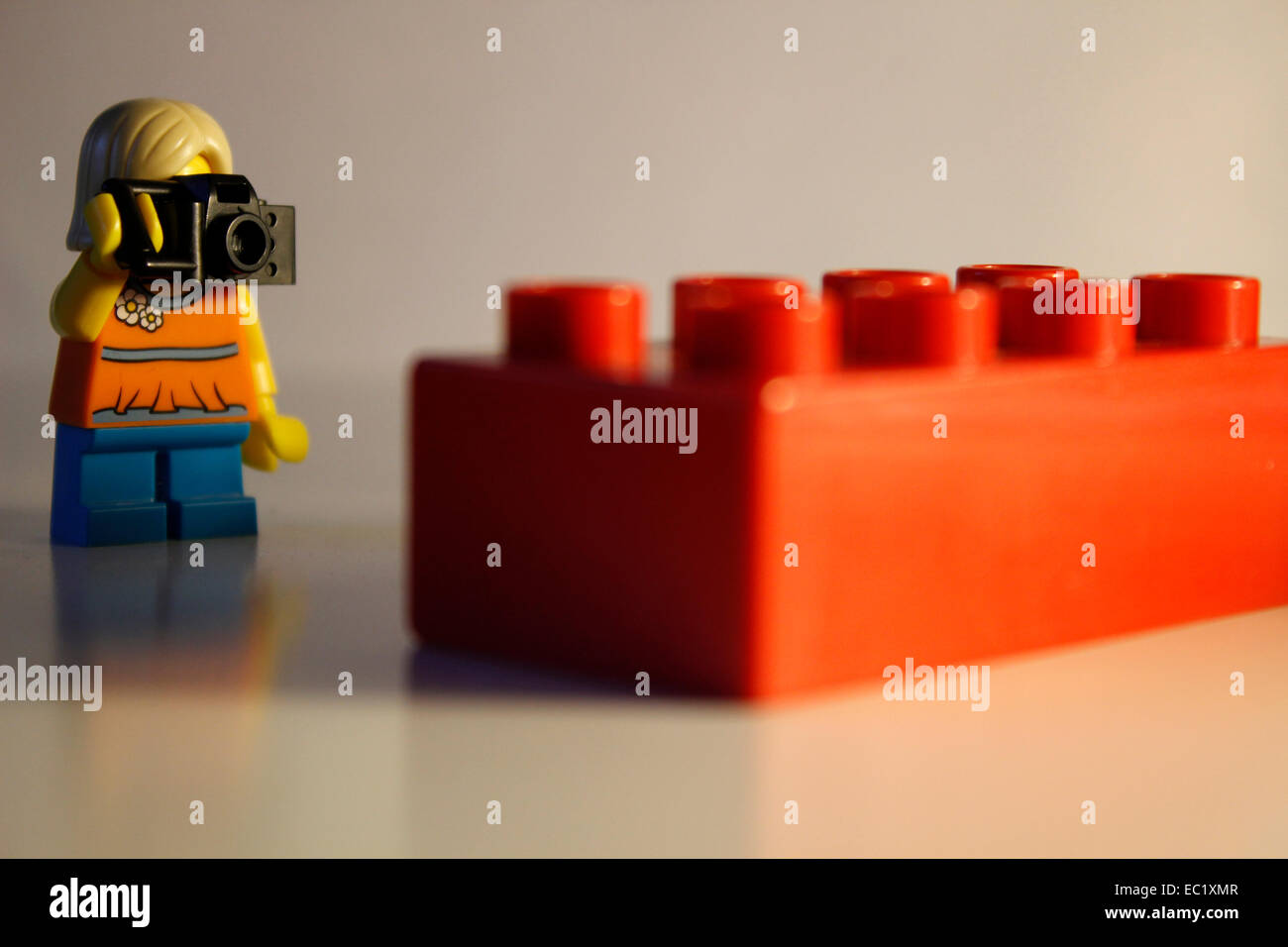 Lego Photographer photographing lego block Stock Photo - Alamy