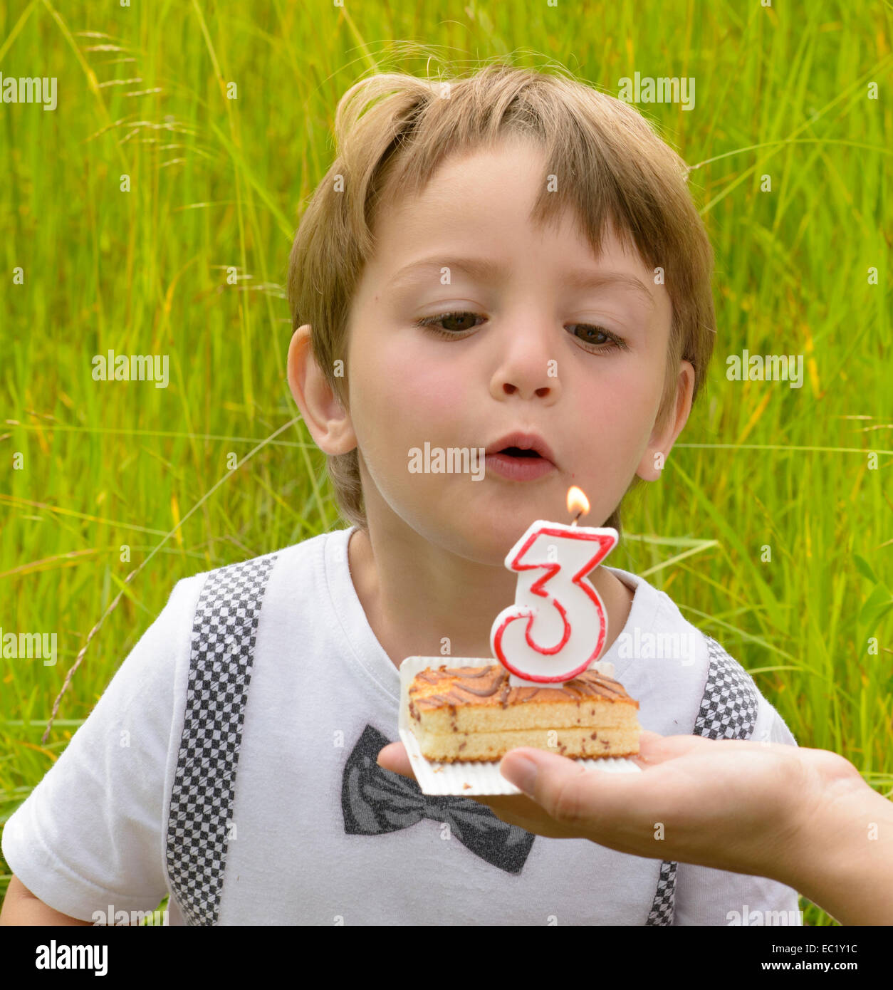 One kid at three years anniversary in nature Stock Photo - Alamy