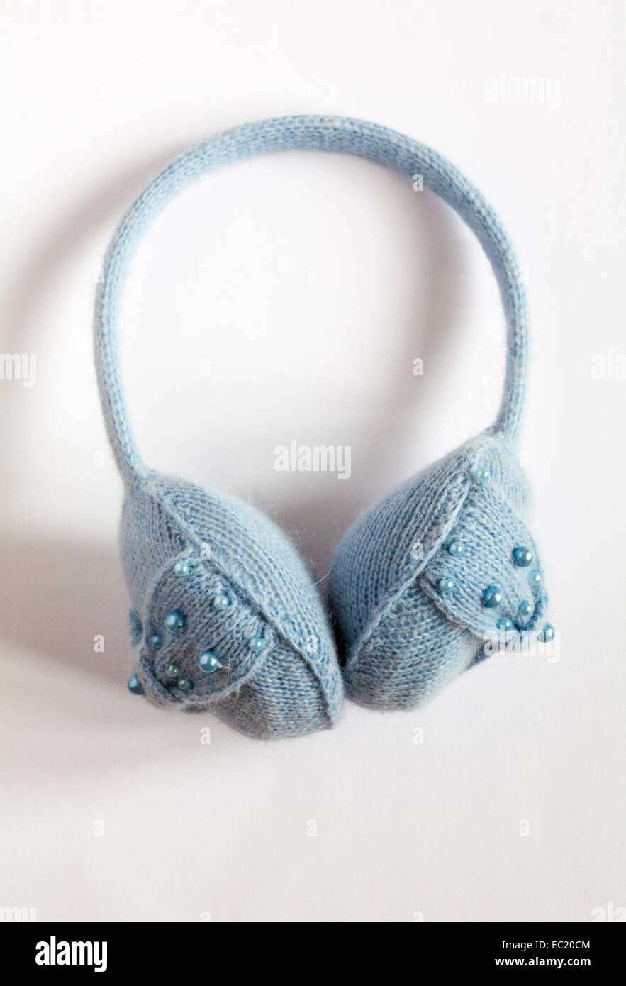 blue earmuffs with Angora and beads isolated on white background ...