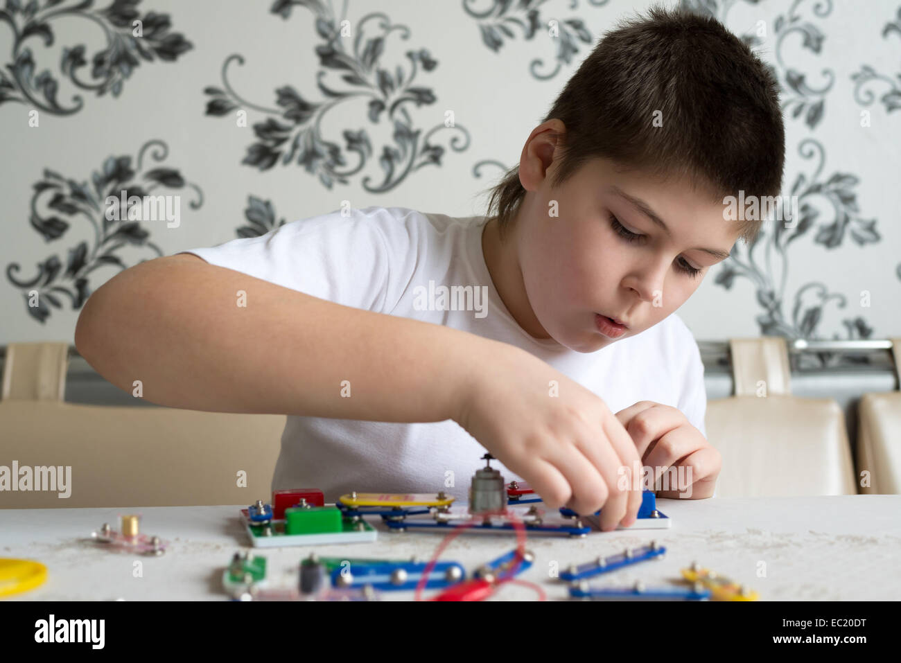 Teen boy at home with electronic project Stock Photo - Alamy