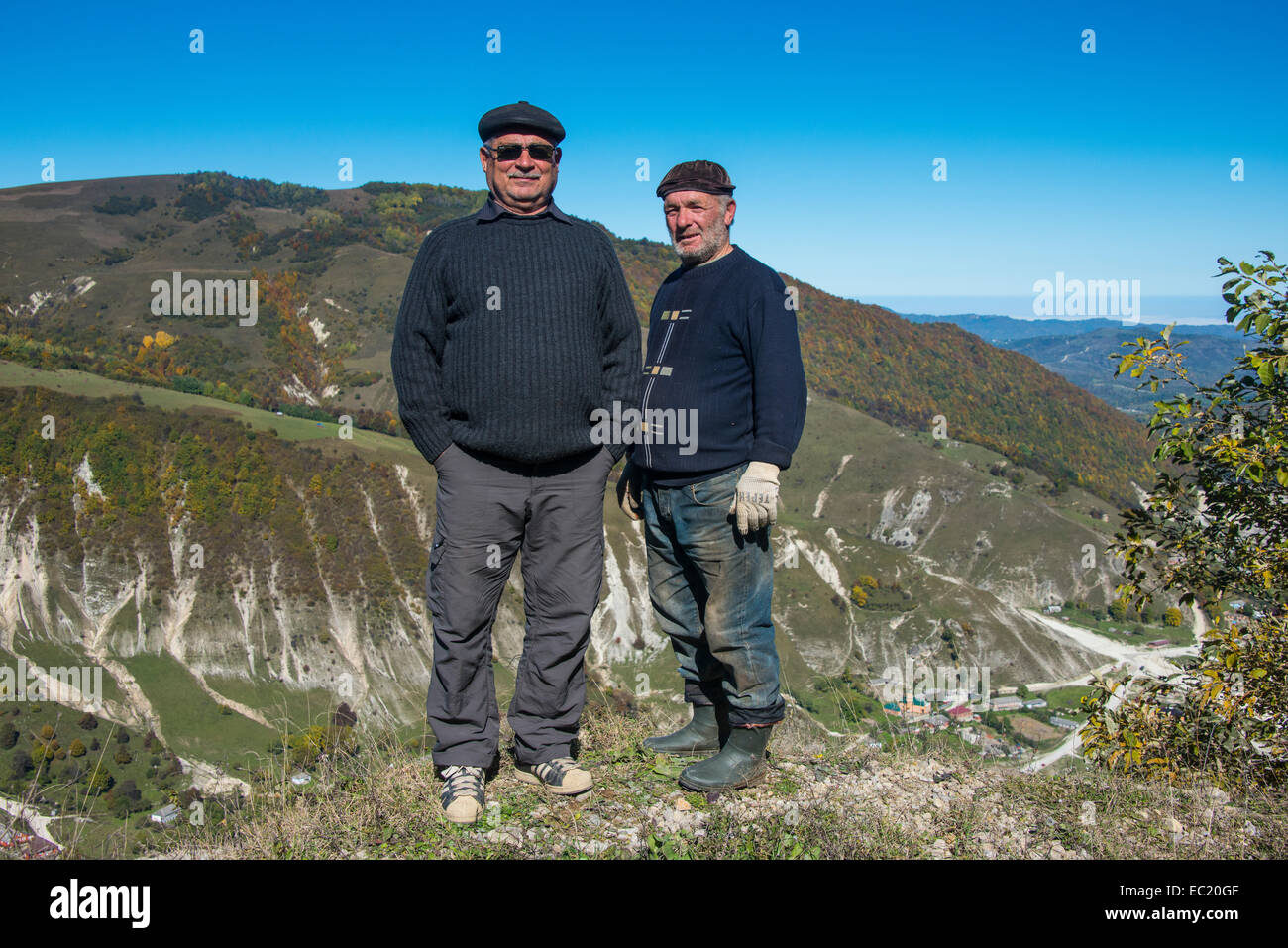 Old Chechen men at an overlook in the Chechen mountains, Chechnya ...