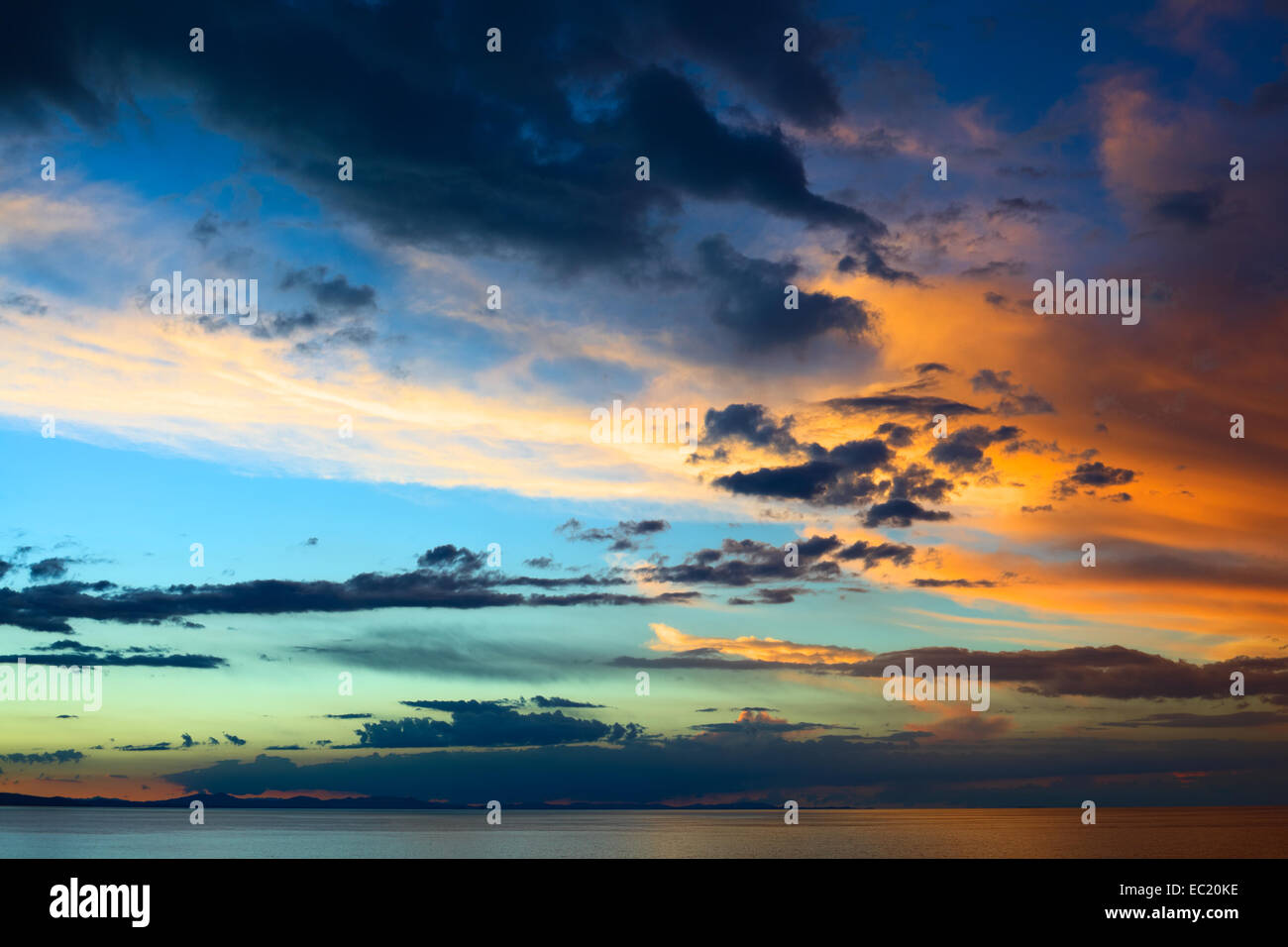 Evening sky with colorfully lit clouds shortly after sunset over Lake ...