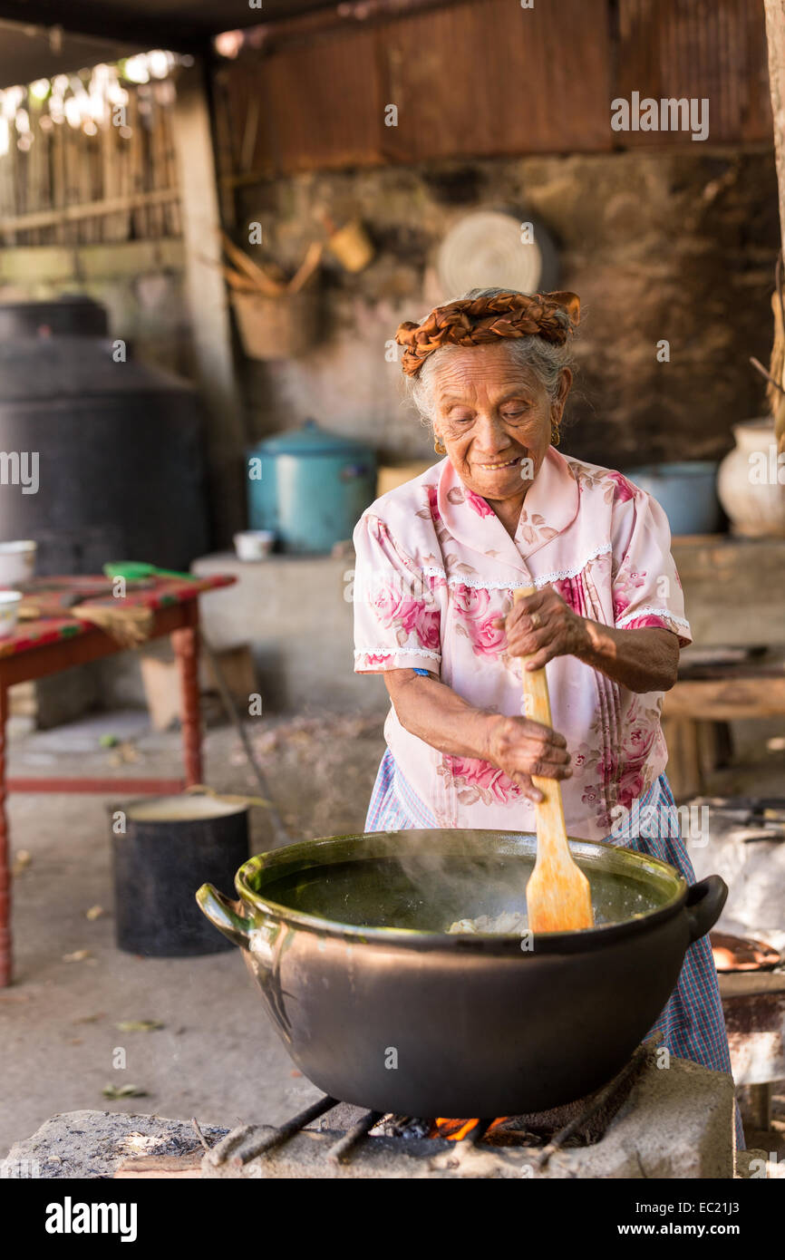 An elderly Oaxacan Zapotec cook prepares traditional food at El Sabor ...