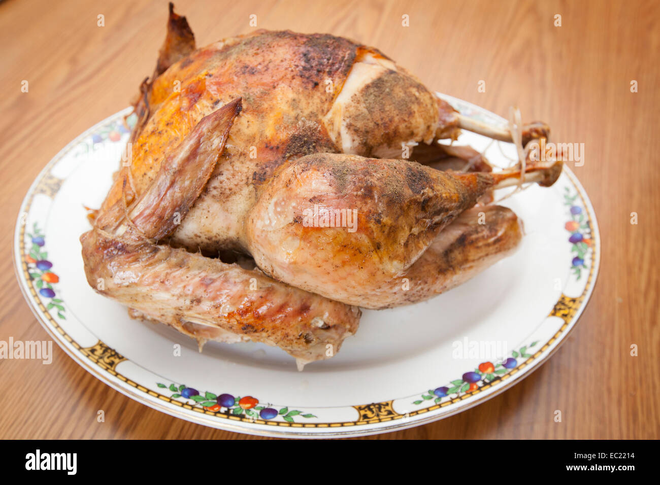 A cooked Thanksgiving Day turkey on a plate Stock Photo - Alamy